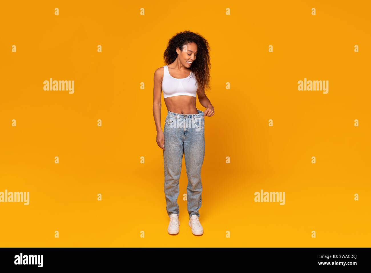 African lady demonstrates perfect body size after weight loss, studio ...