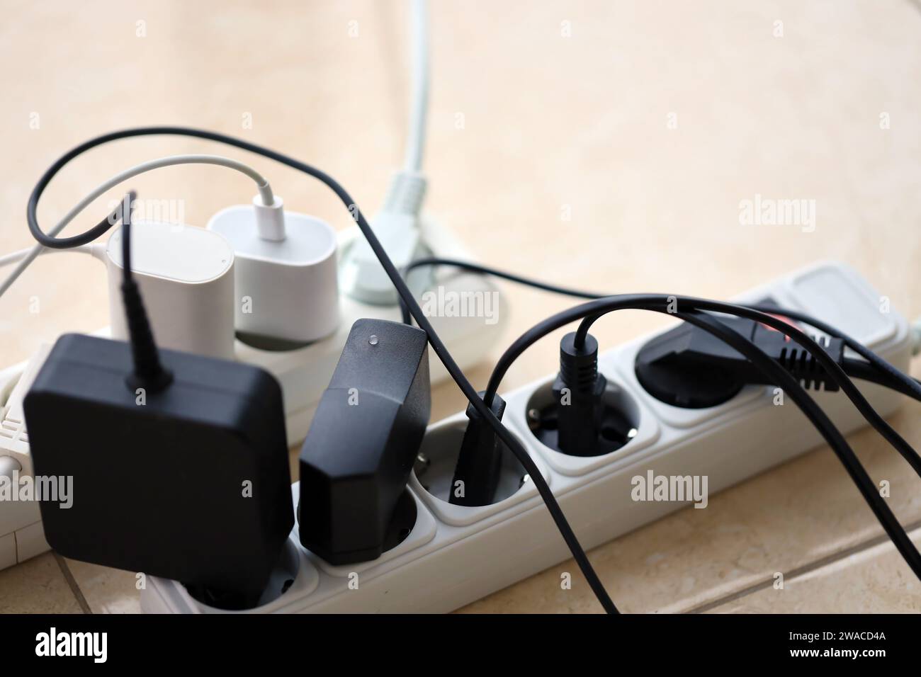 Overloaded power boards. Power strips with different electrical plugs ...