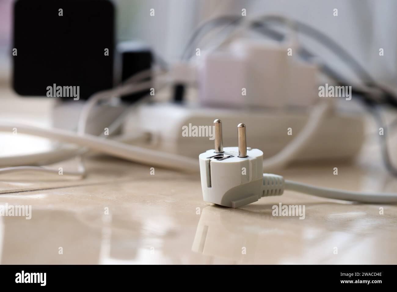 Overloaded power boards. Power strips with different electrical plugs ...