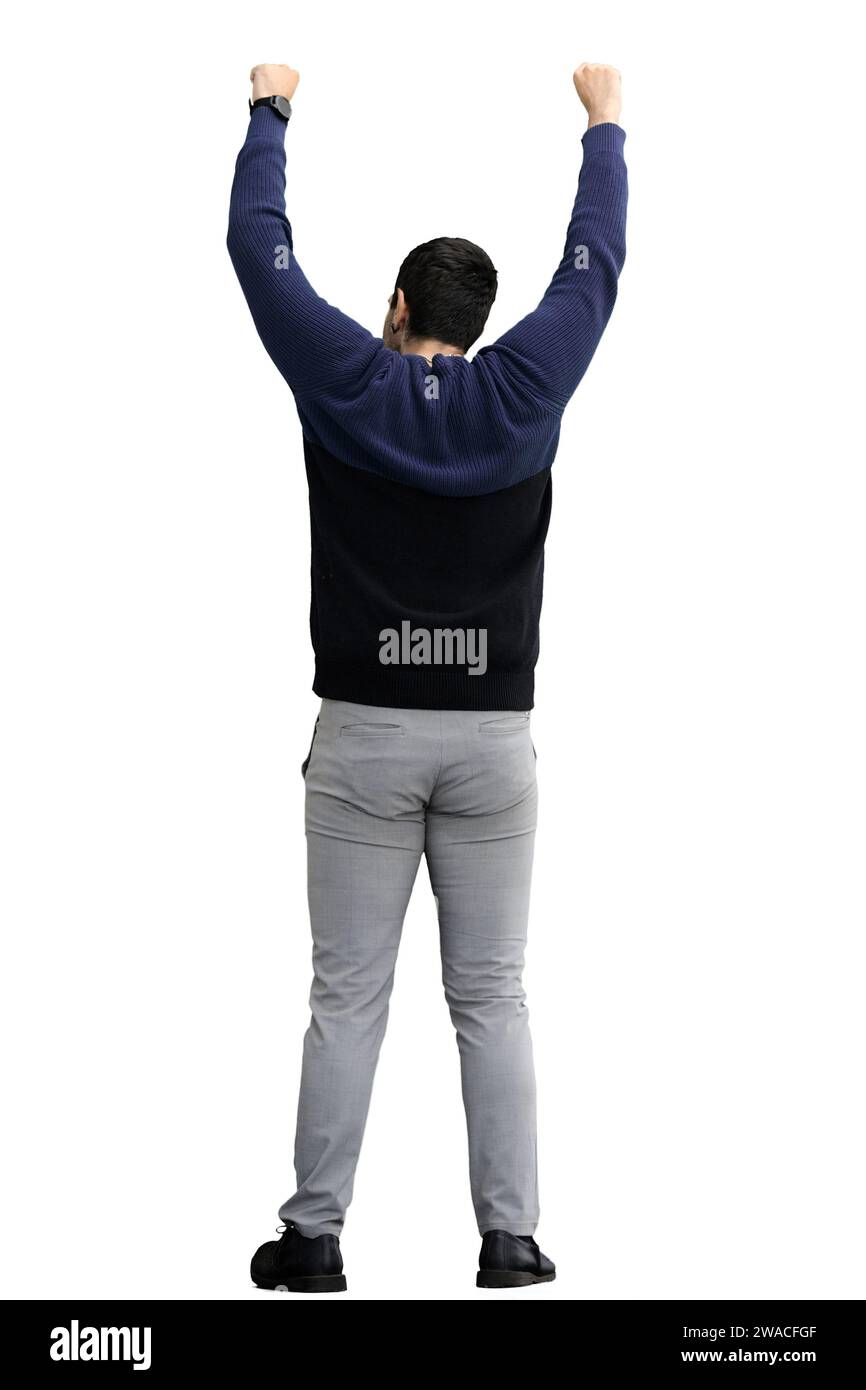 A man in a black sweater on a White background raised his hands up ...