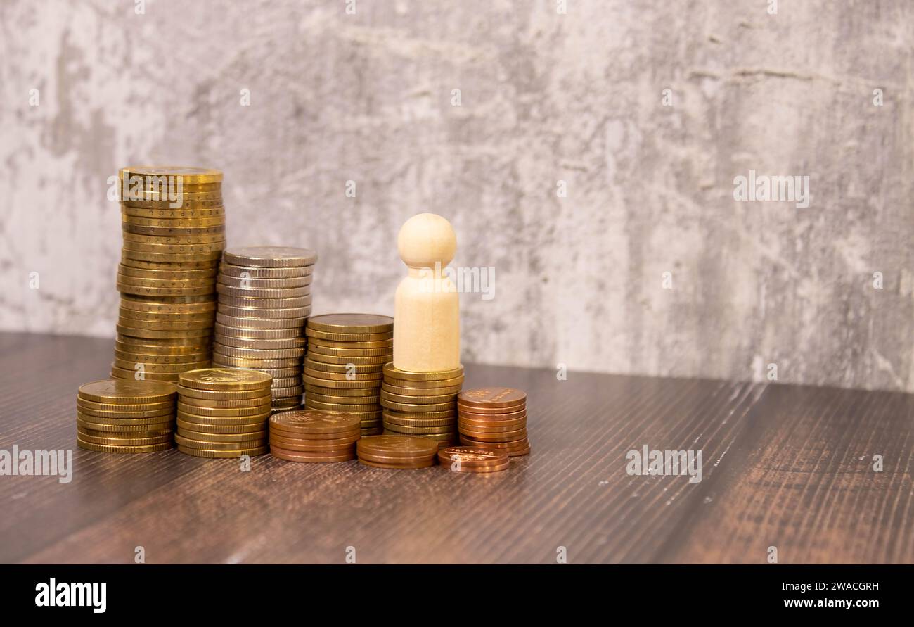 coin ladder, wooden figures, cunning and ingenuity Stock Photo - Alamy