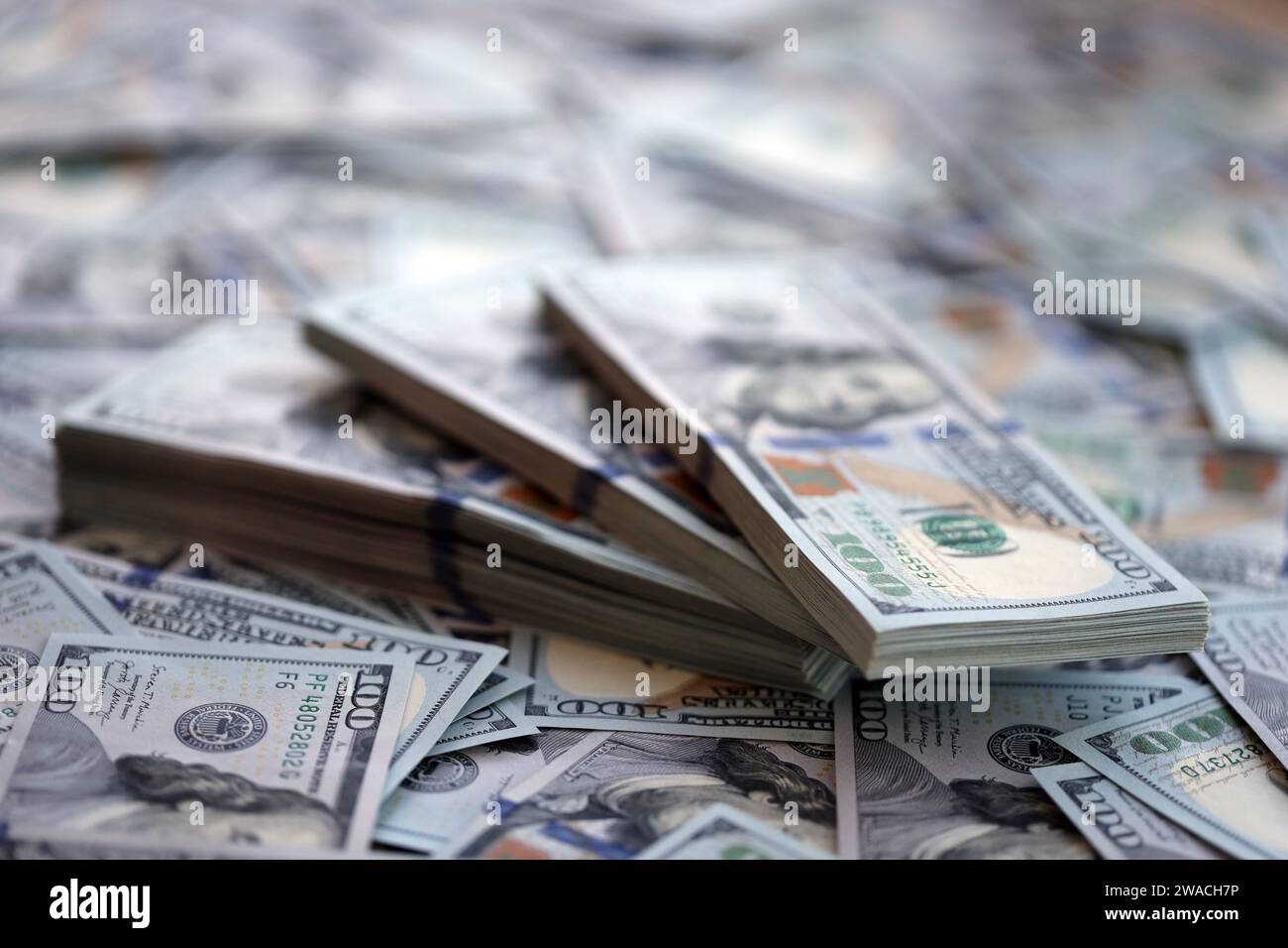 Very big amount of US hundred dollar bills close up. Huge quantity of ...
