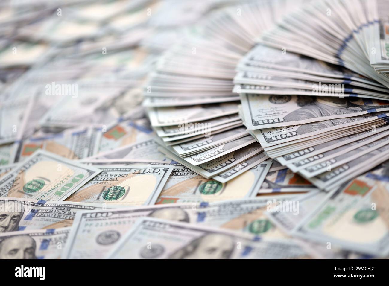 Very big amount of US hundred dollar bills close up. Huge quantity of ...