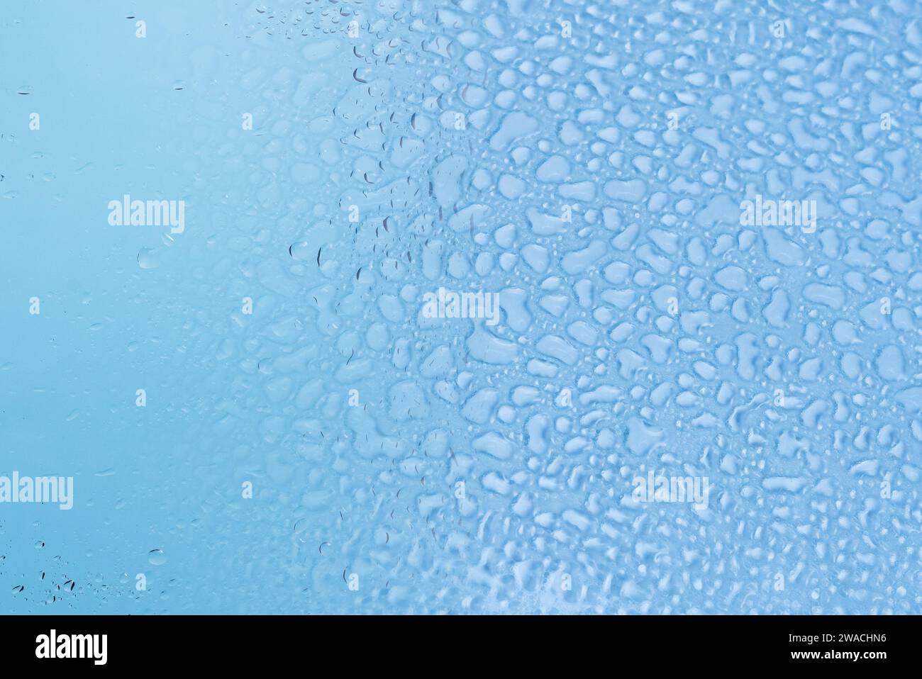 Blue glass with water drops. Wet glass. Copy space Stock Photo - Alamy