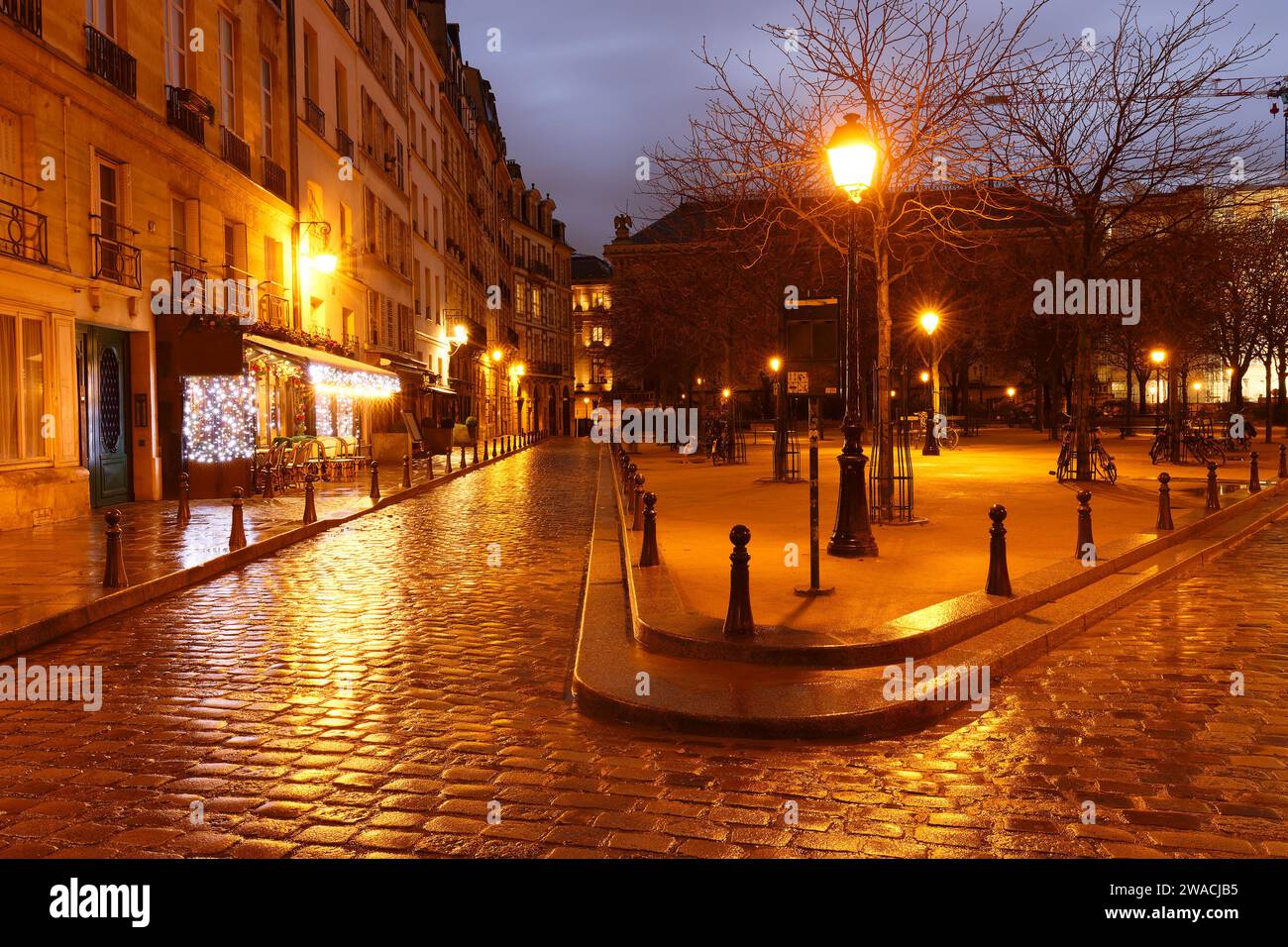 Paris at rainy night cityscape. Wet cobblestone Stock Photo - Alamy