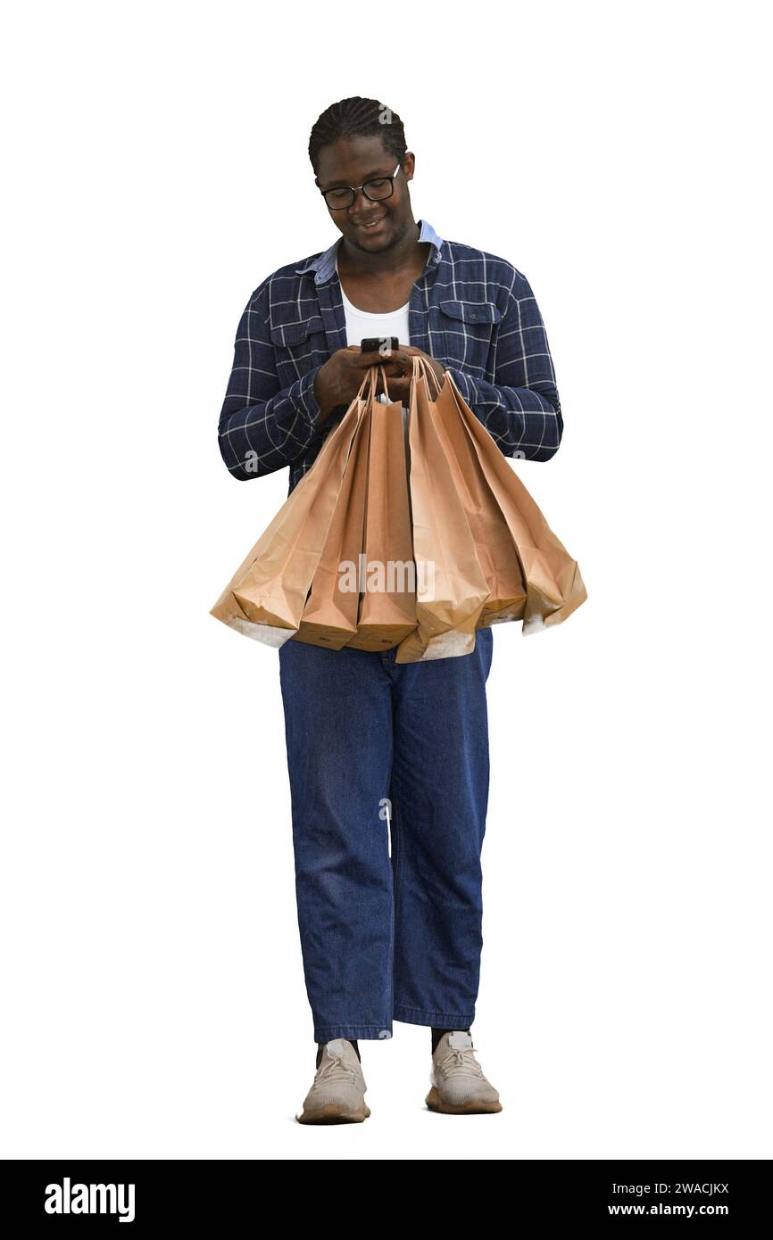 A man in a shirt on a White background with bags in his hands Stock ...