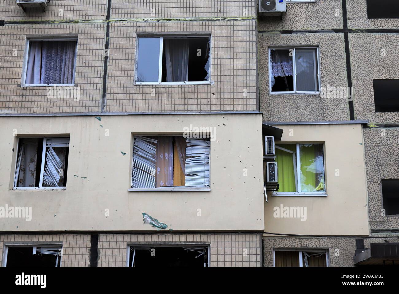 War in Ukraine. Broken windows in destroyed house after rocket attack ...