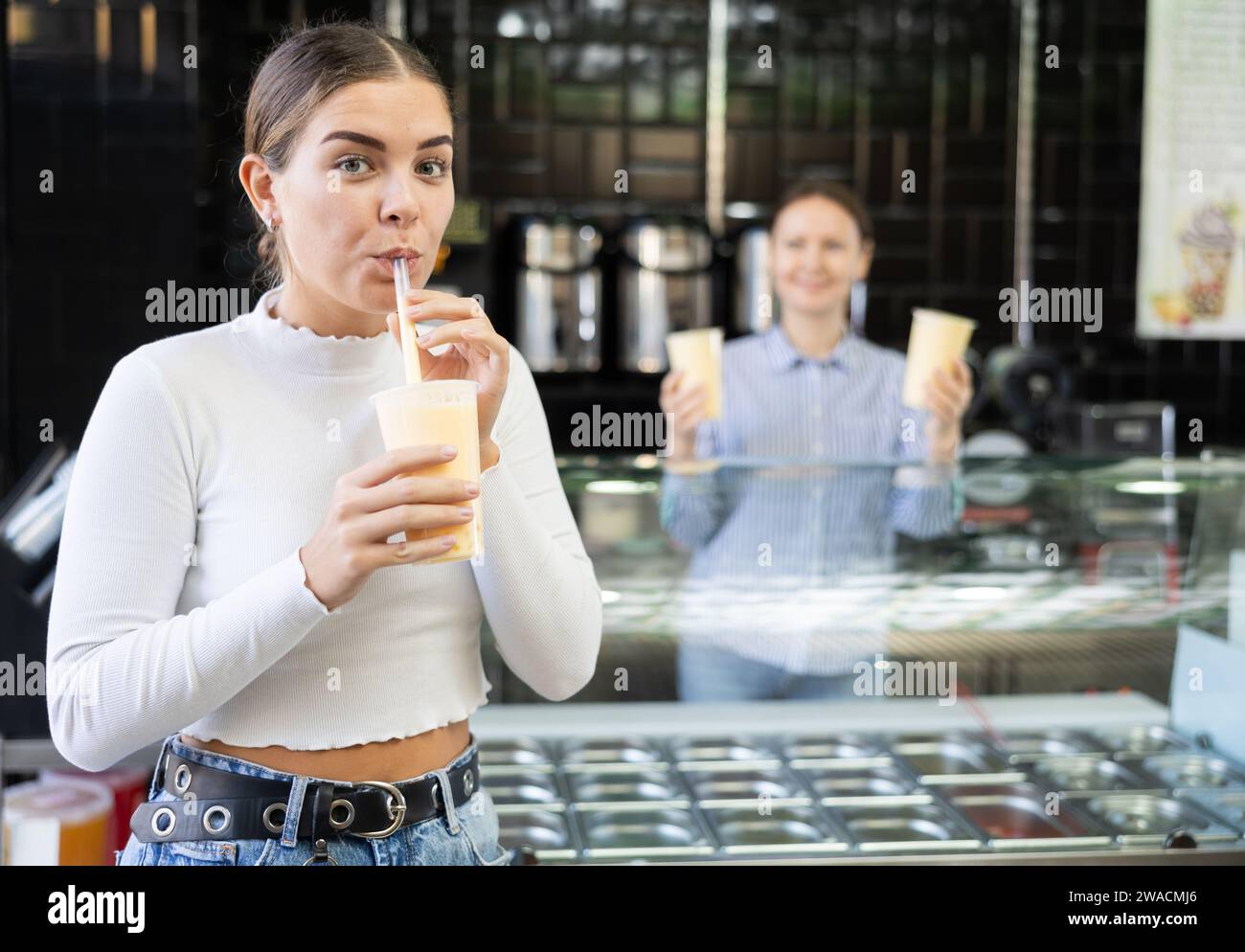 Happy young girl enjoying traditional Taiwanese bubble tea Stock Photo ...