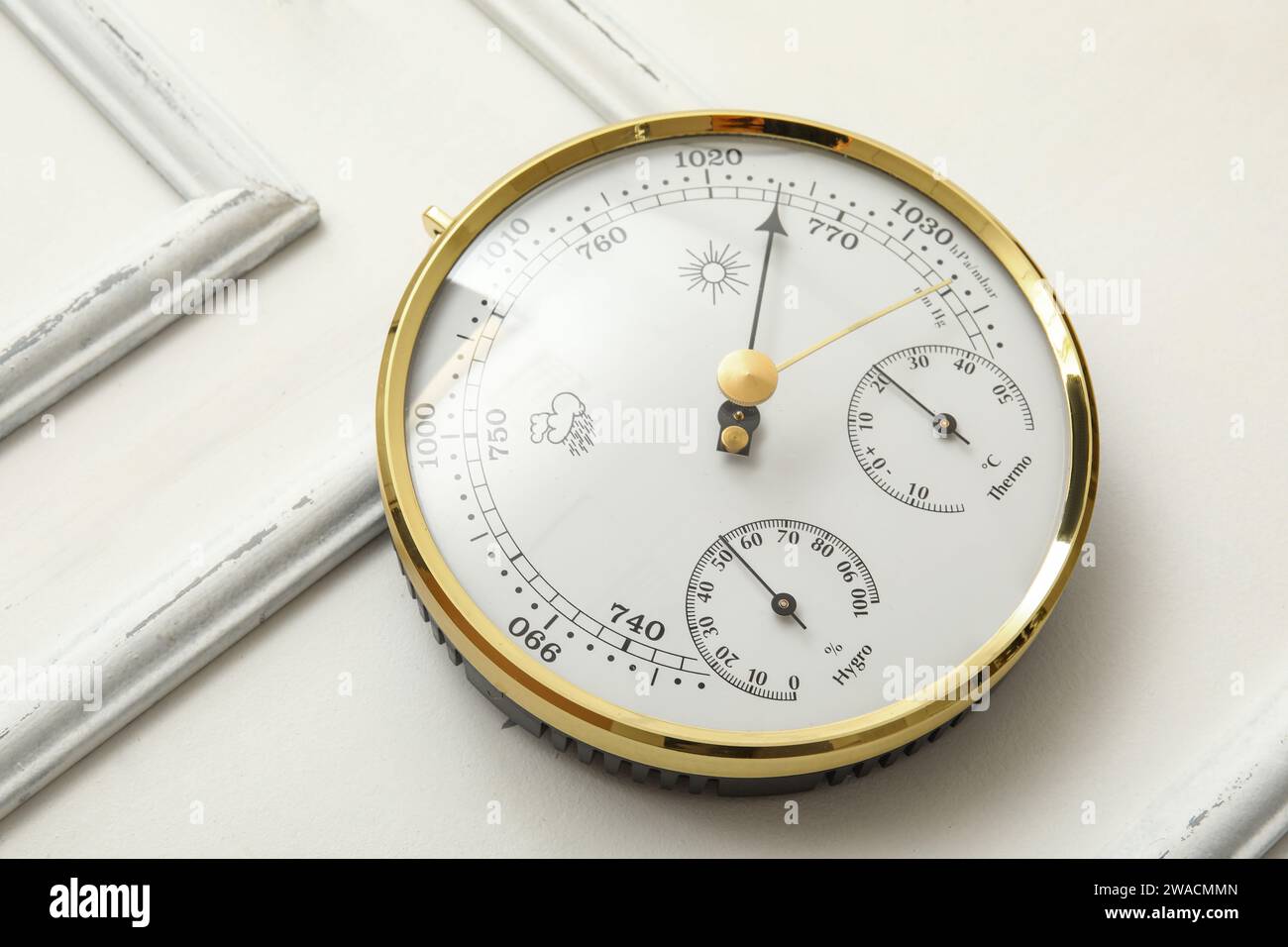 Aneroid barometer on white wooden background Stock Photo - Alamy