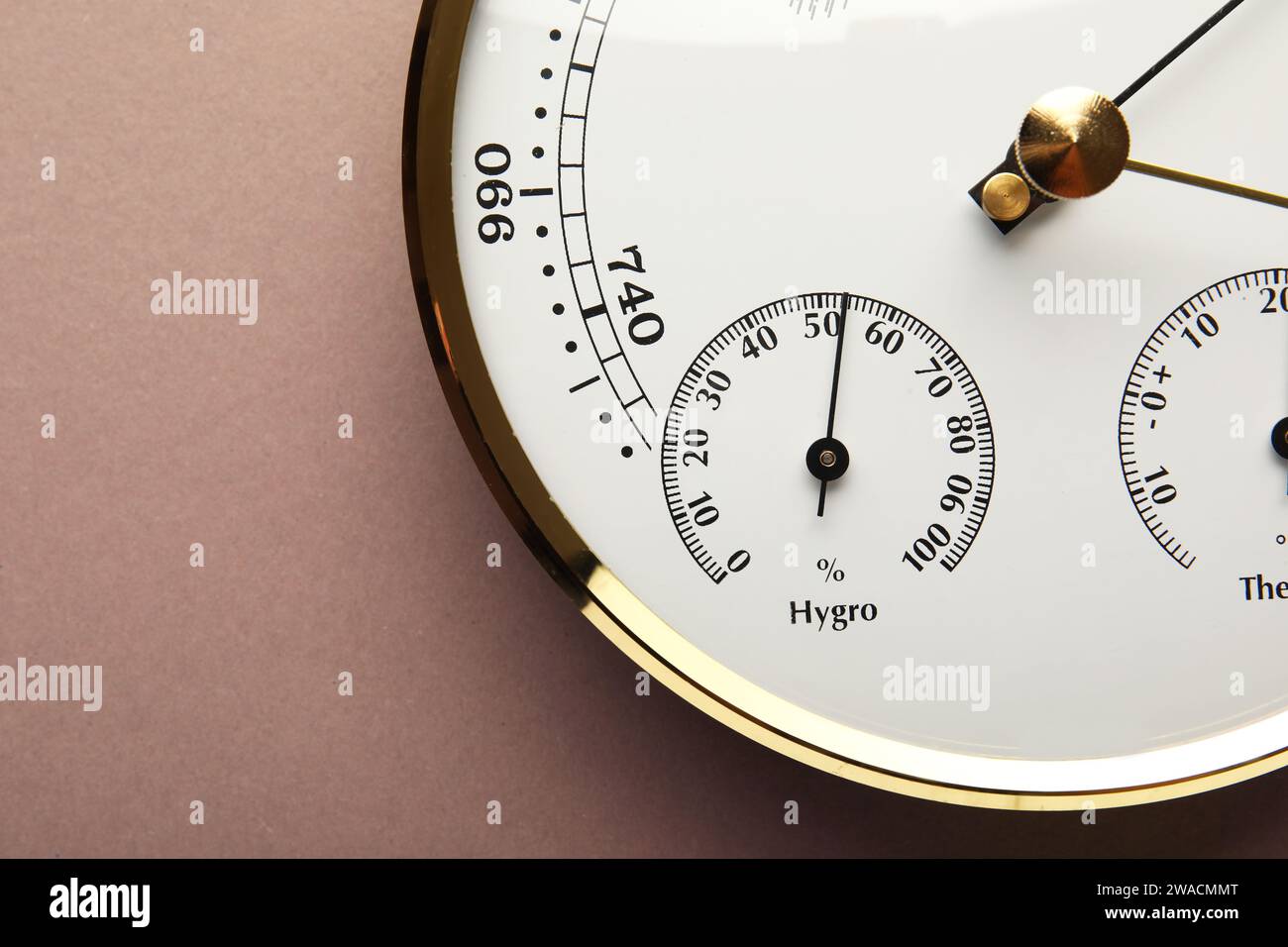 Aneroid barometer on brown background Stock Photo - Alamy
