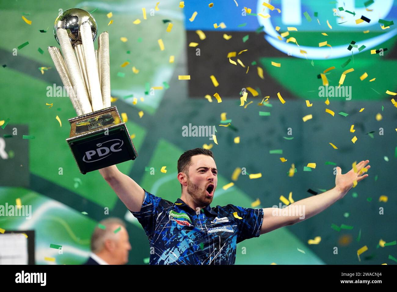 Luke Humphries celebrates with the trophy after beating Luke Littler in ...