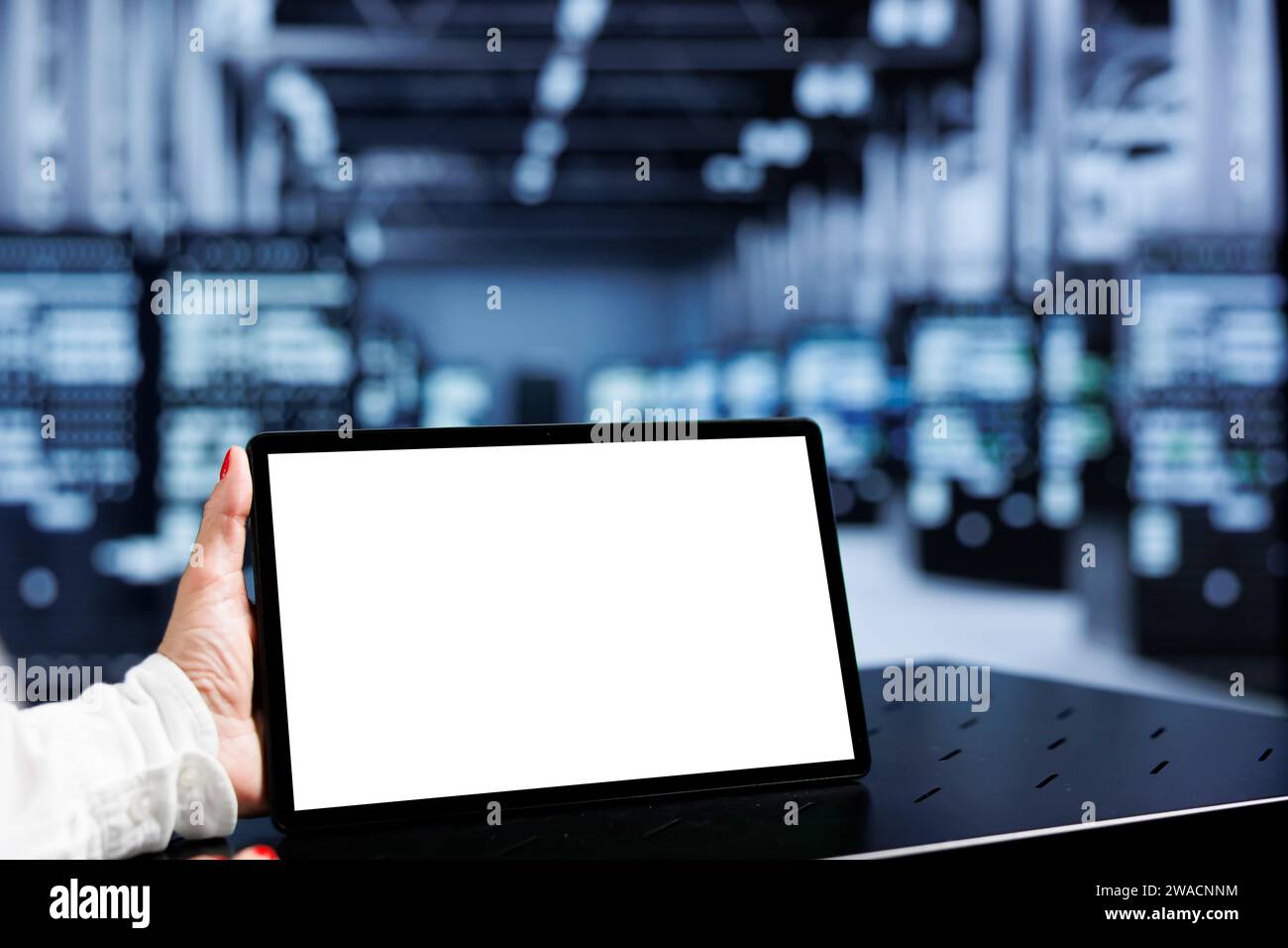 Close up shot of mock up tablet used by technician in server hub ...