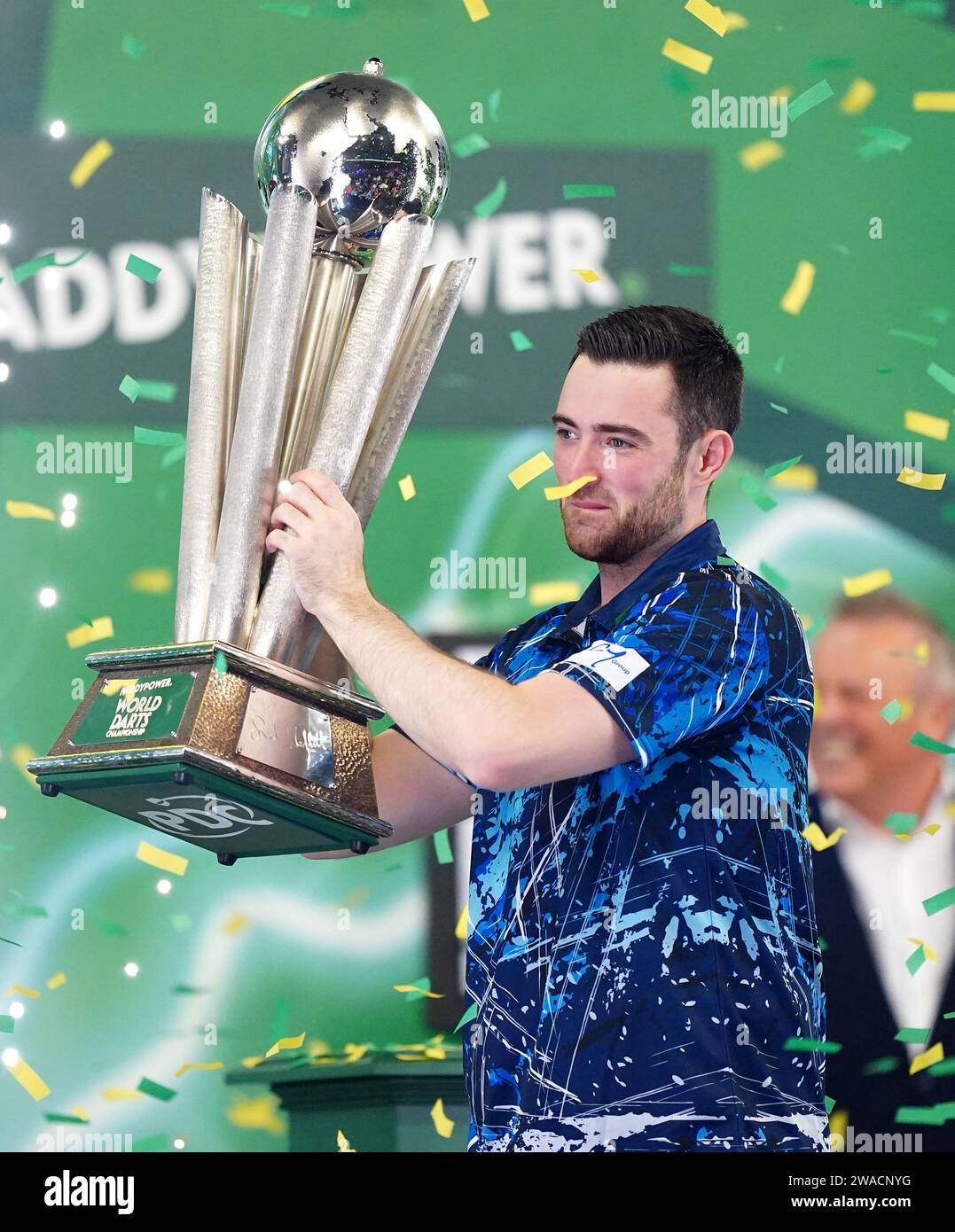 Luke Humphries celebrates with the trophy after beating Luke Littler in ...