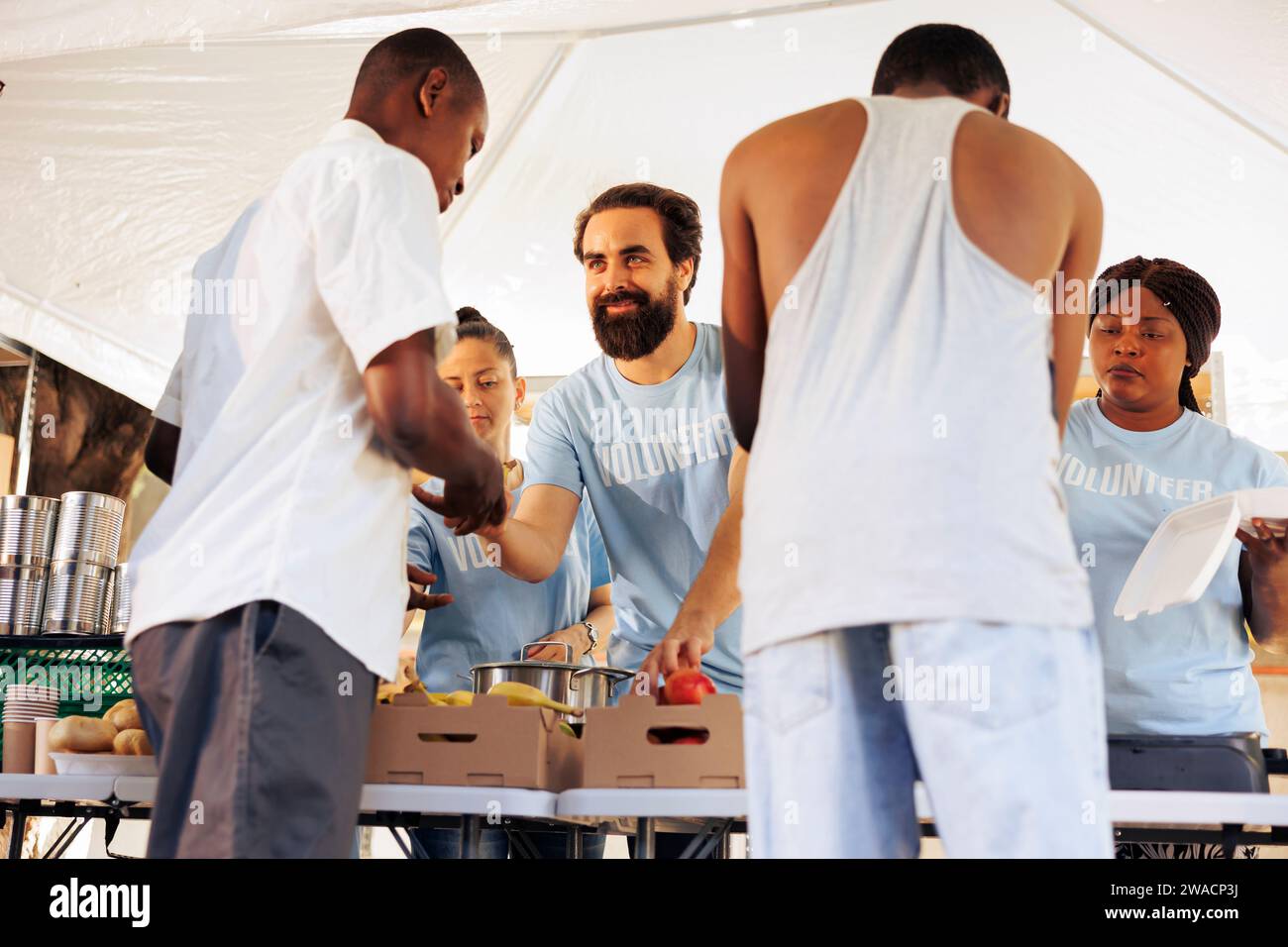 Volunteers supporting and donating fresh produce to the needy and ...