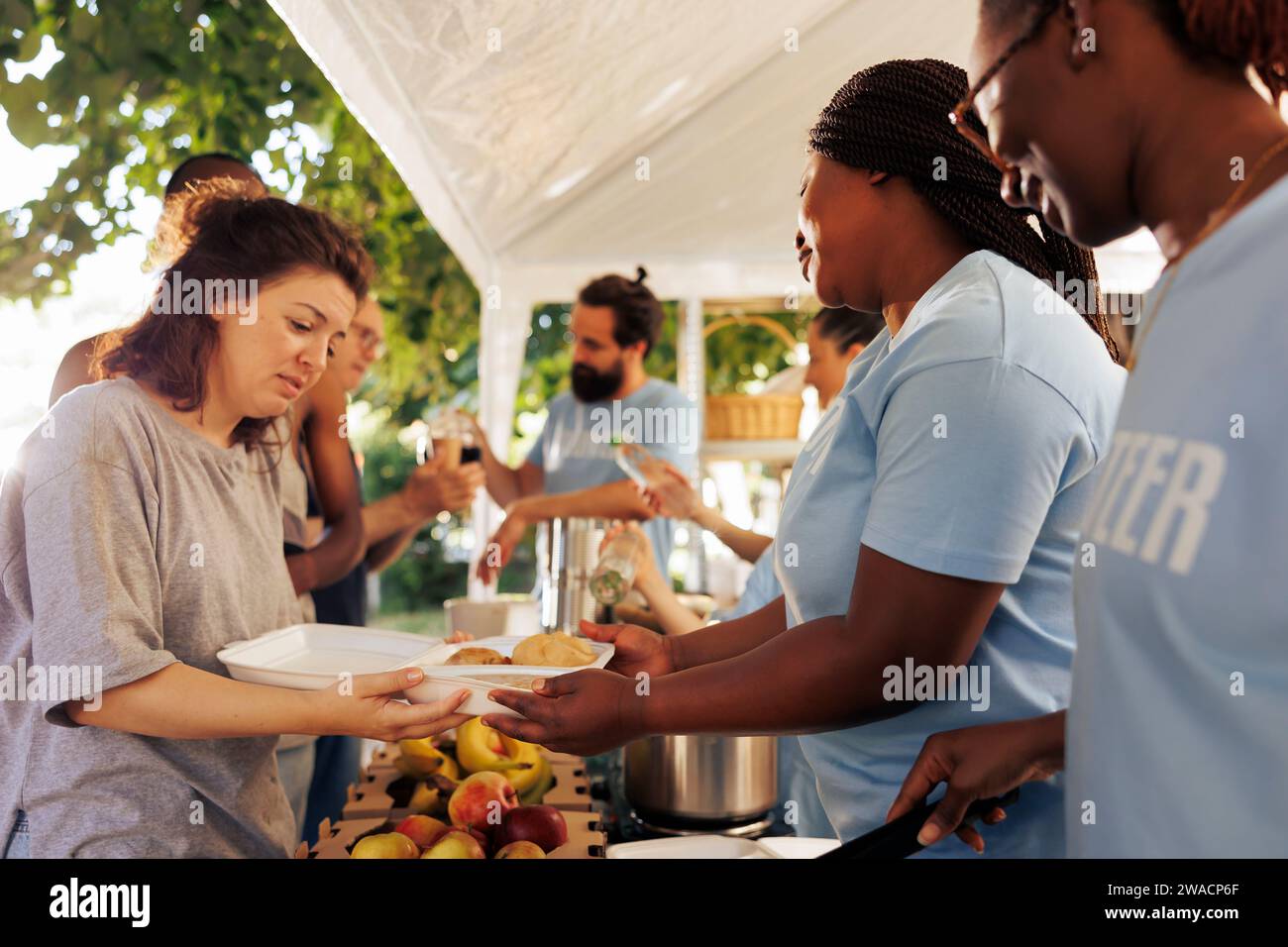 African poverty food sharing hi-res stock photography and images - Alamy