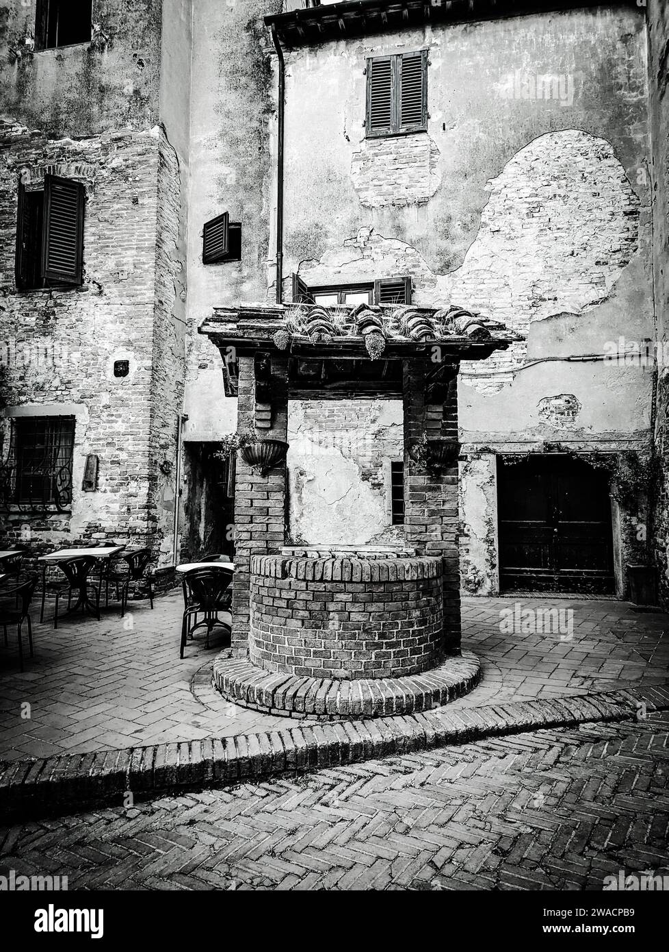 An old water well in the center of old Certaldo in the Tuscany, Italy ...