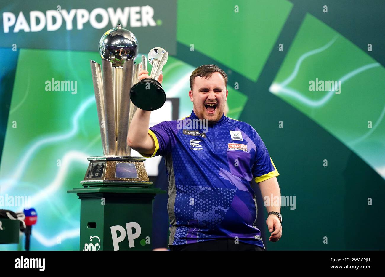 Luke Littler celebrates with his runners up trophy after being beaten ...