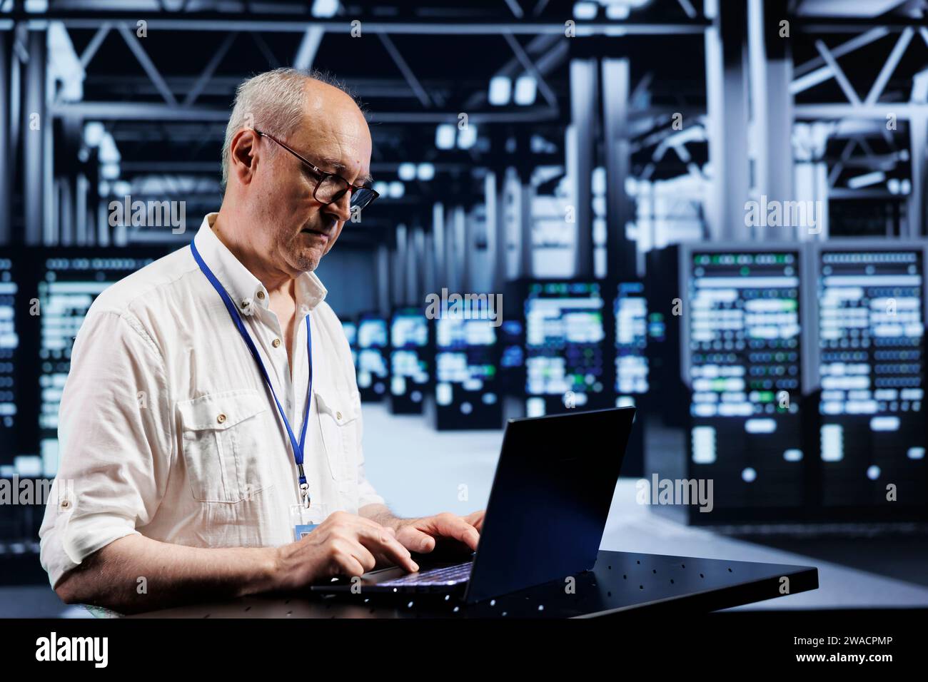 Experienced serviceman using laptop, setting up high bandwidth ...