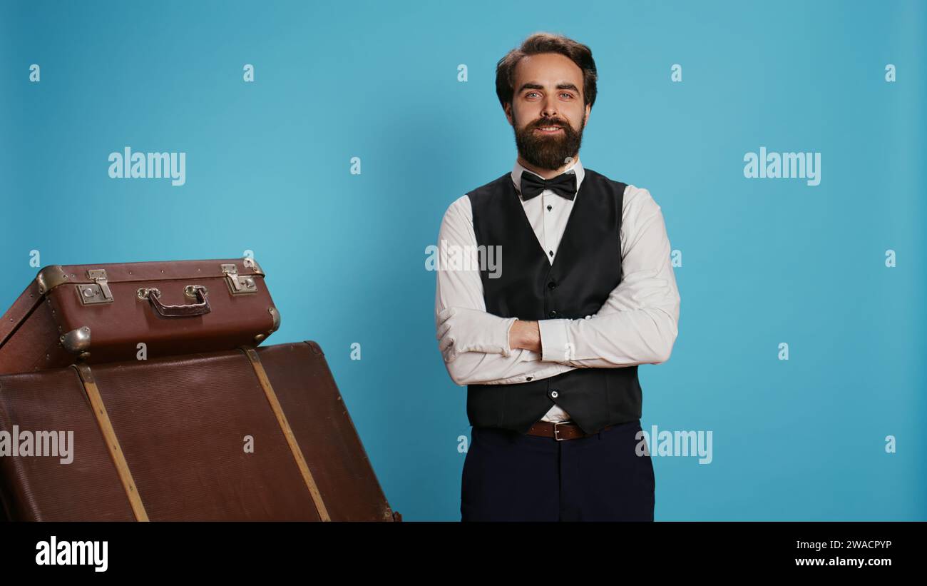 Hotel bellhop wearing gloves uniform hi-res stock photography and ...