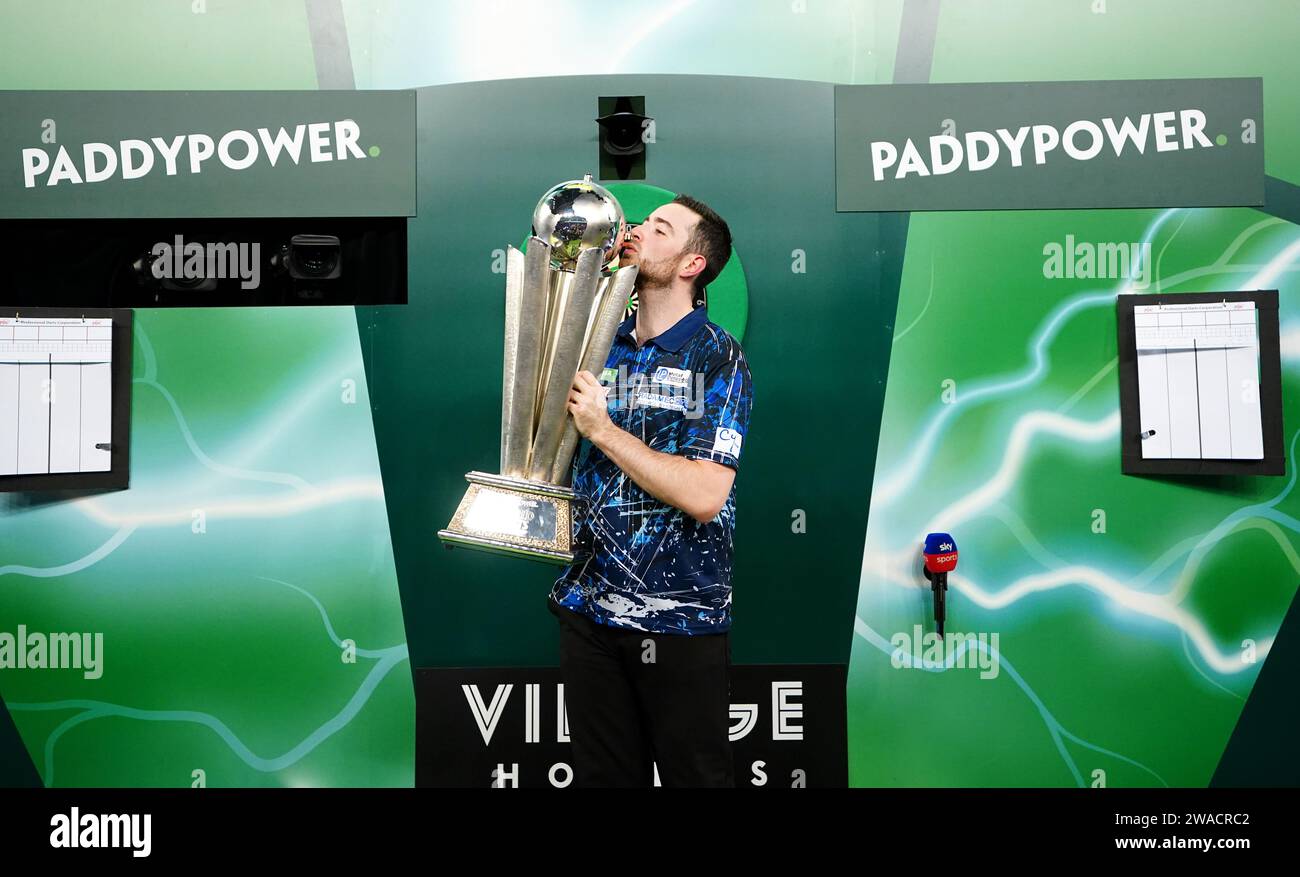 Luke Humphries celebrates with his trophy after beating Luke Littler in ...