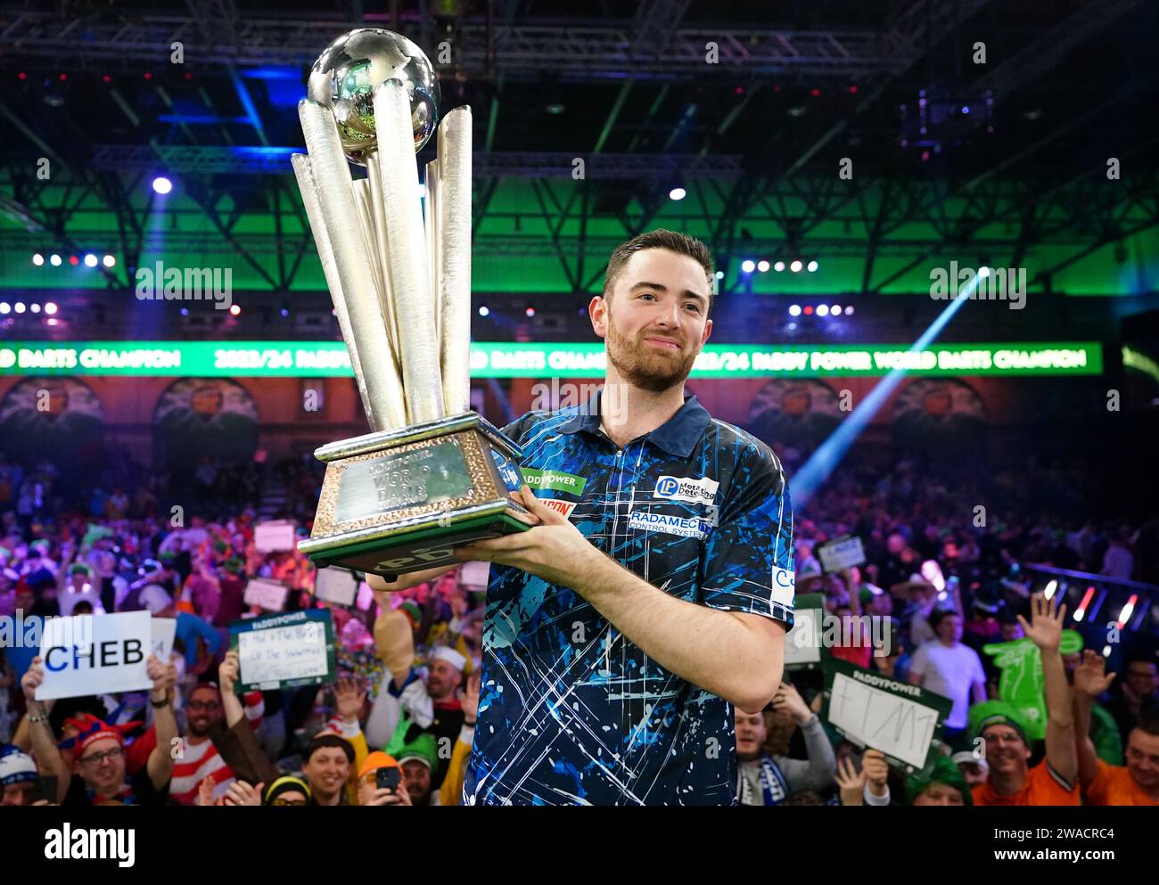 Luke Humphries celebrates with his trophy after beating Luke Littler in ...