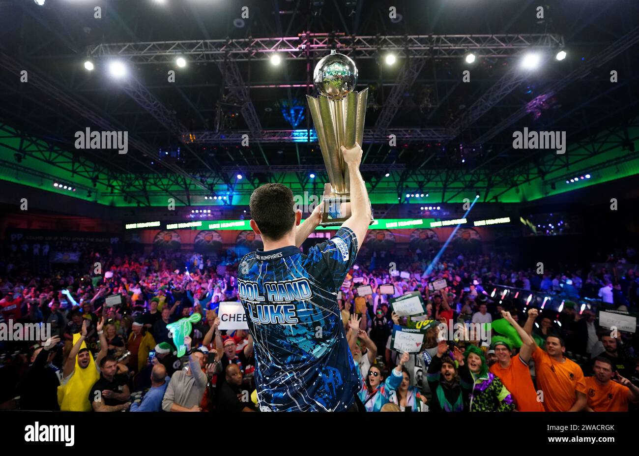 Luke Humphries celebrates with his trophy after beating Luke Littler in ...