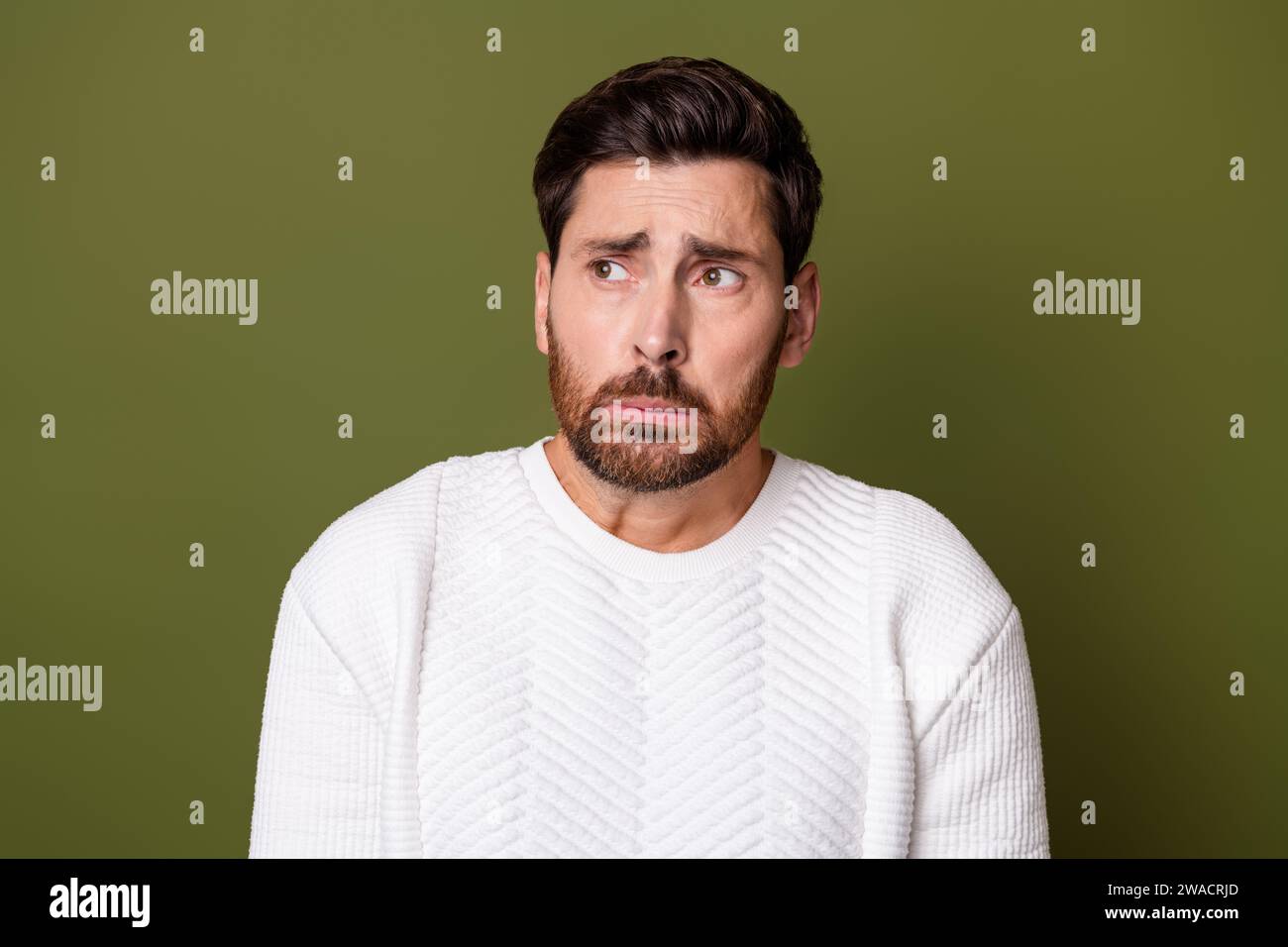 Photo of attractive worried anxious man wear stylish white pullover ...