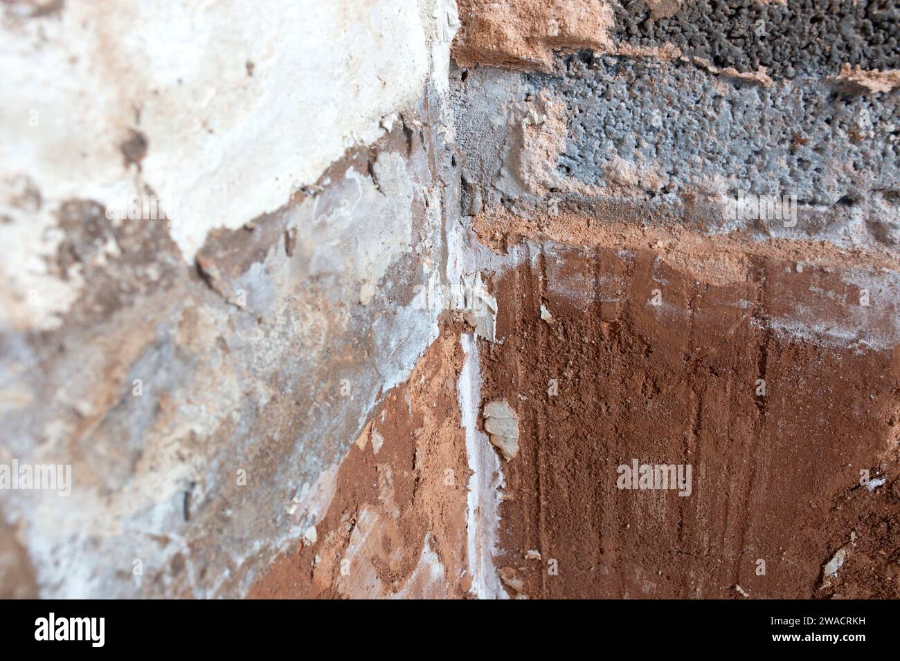 Damaged damp plaster exposing brick in a bathroom. Home improvement ...