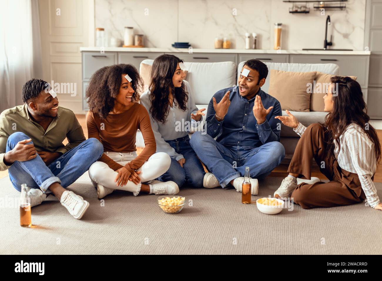 Diverse group friends playing who hi-res stock photography and images ...