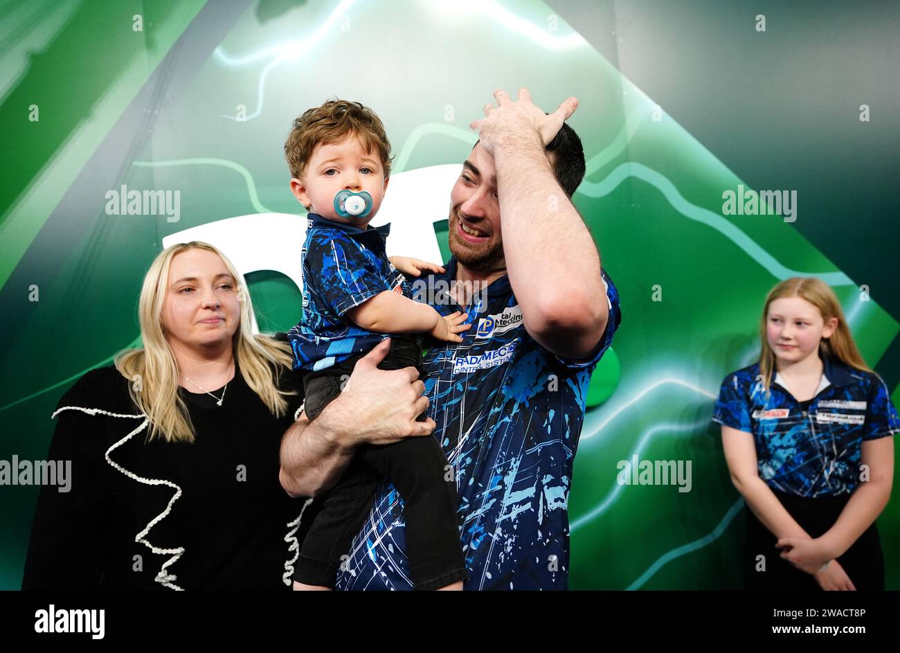 Luke Humphries celebrates with his family after winning the final of ...