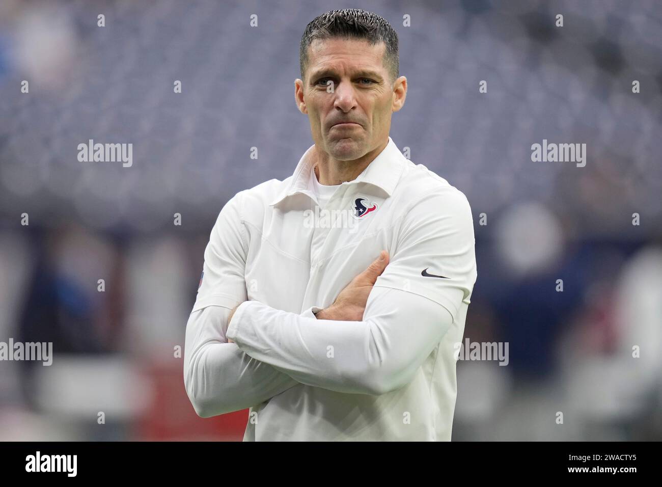 Houston Texans general manager Nick Caserio walks on the field before an NFL football game ...