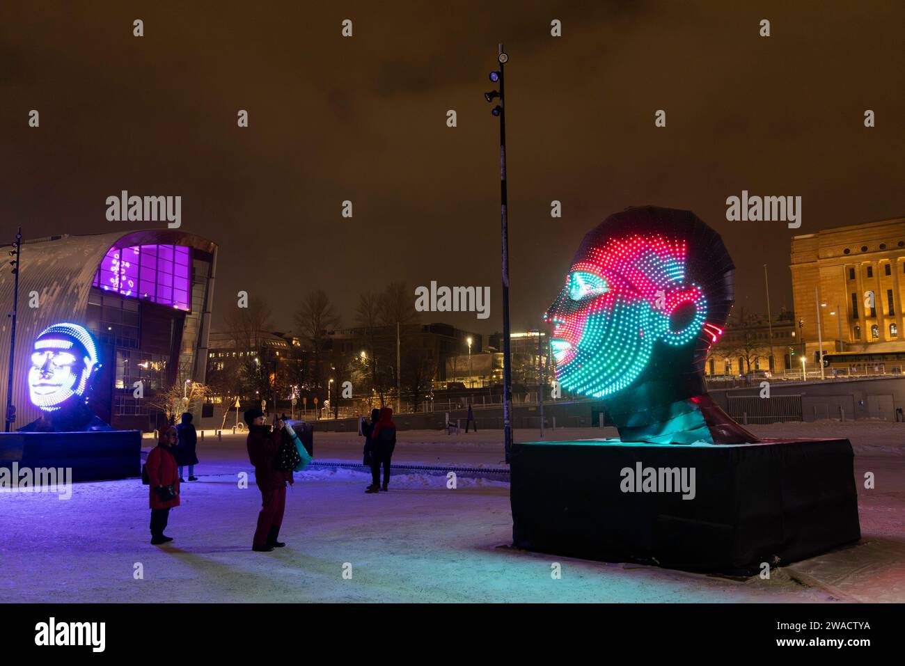 Helsinki, Finland. 3rd Jan, 2024. People look at an illuminated ...