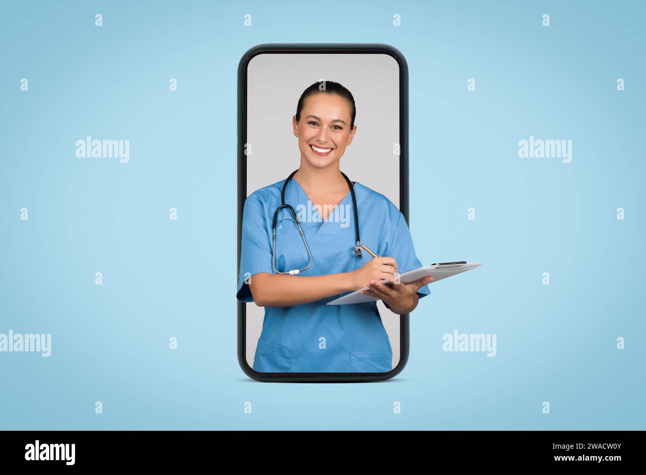 Happy european woman doctor write at clipboard on big smartphone screen ...