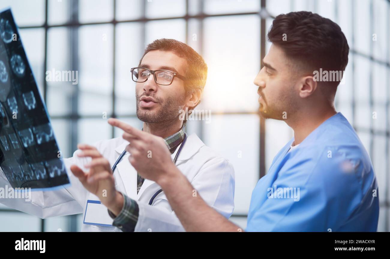 Team doctors look examine hi-res stock photography and images - Alamy