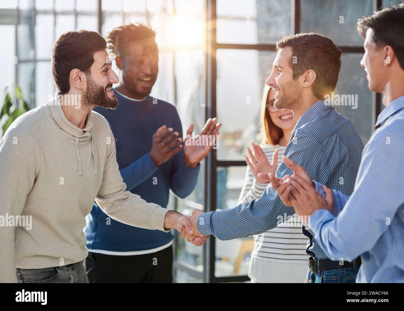Shot of a happy businessman welcoming his new colleague to the team ...