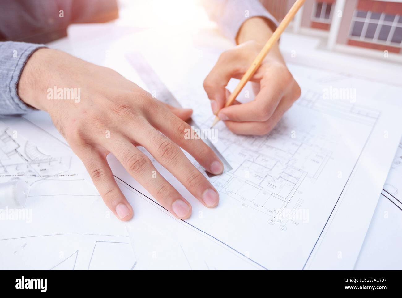 designer drawing graphic design of building project, improvement at ...