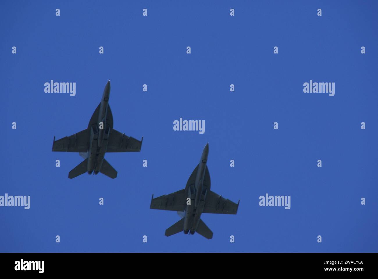 A pair of F/A-18 Hornets conduct a flyover during an Oct. 3, 2009 ...