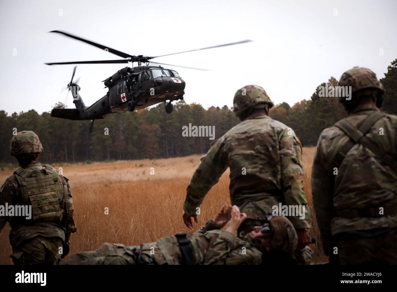 U.S. Army UH-60L Black Hawk helicopter crew chiefs with Charlie Company ...