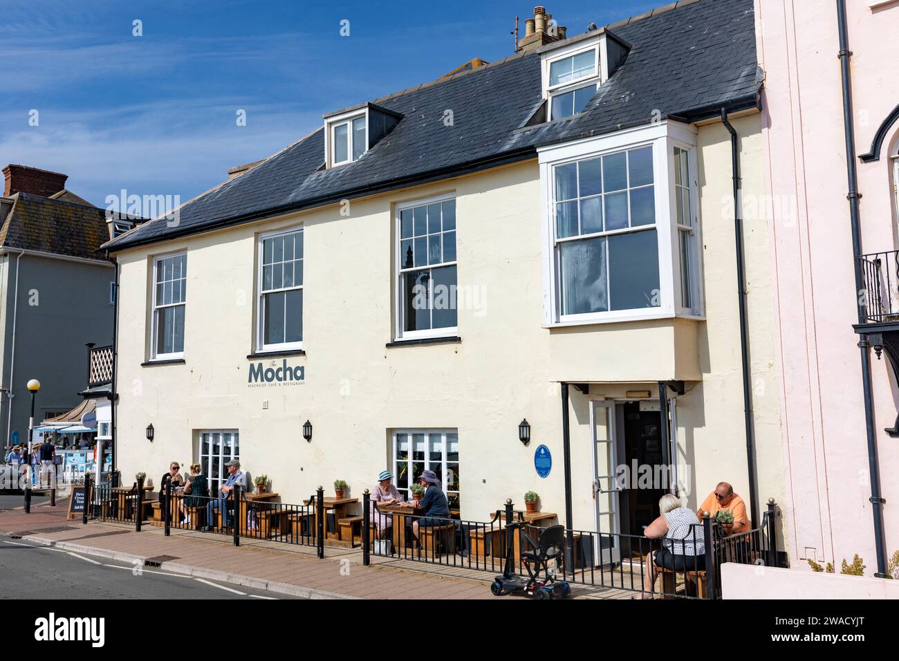 Sidmouth town centre Devon, Mocha cafe and restaurant with people ...