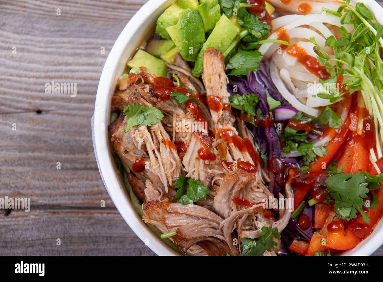 Delicious pulled pork loaded ramen bowl dish closeup with veggies Stock ...