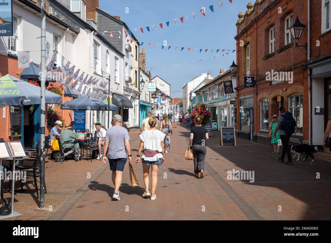 Sidmouth town centre in Devon, people shopping along Old Fore street on ...