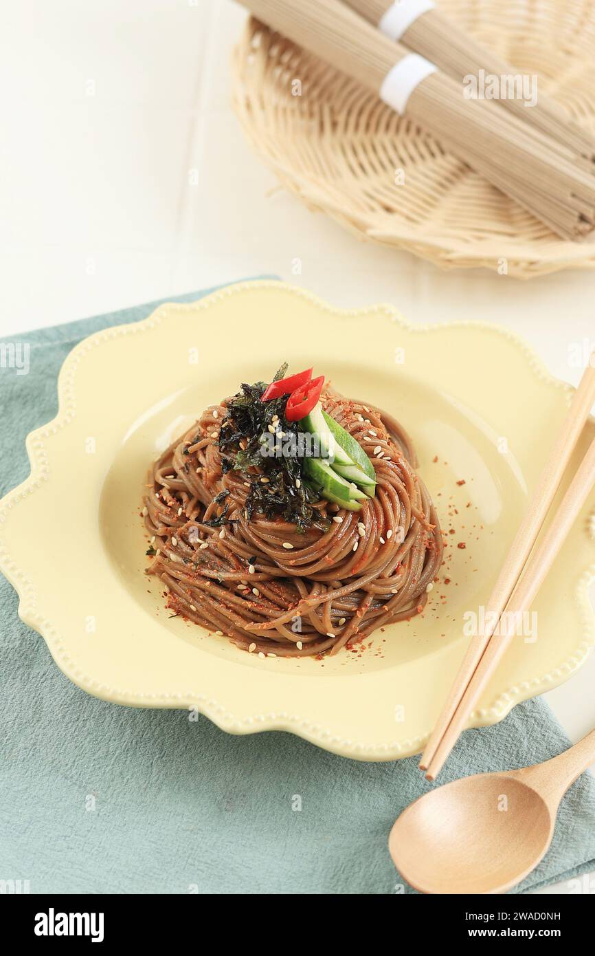 Spicy Soba Korean Noodle Bibim Guksu with Chilli Flakes, Cucumber, and ...