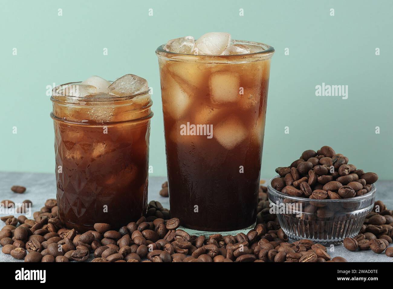 Two Glass of Iced Americano Coffee with Coffee Beans on Mint Background ...