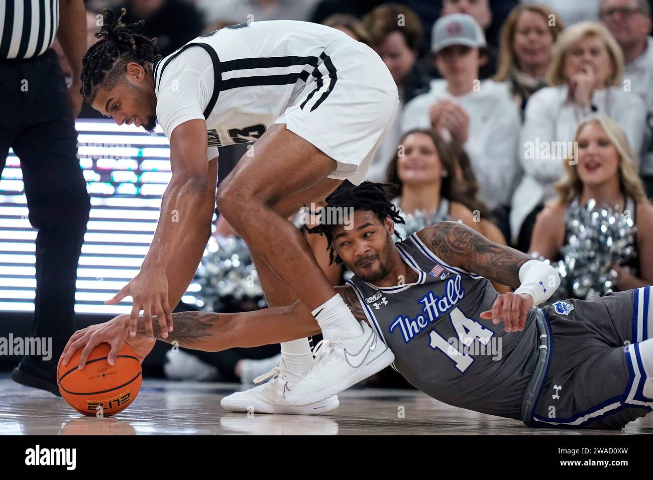 Providence forward Bryce Hopkins, left, and Seton Hall guard Dre Davis ...