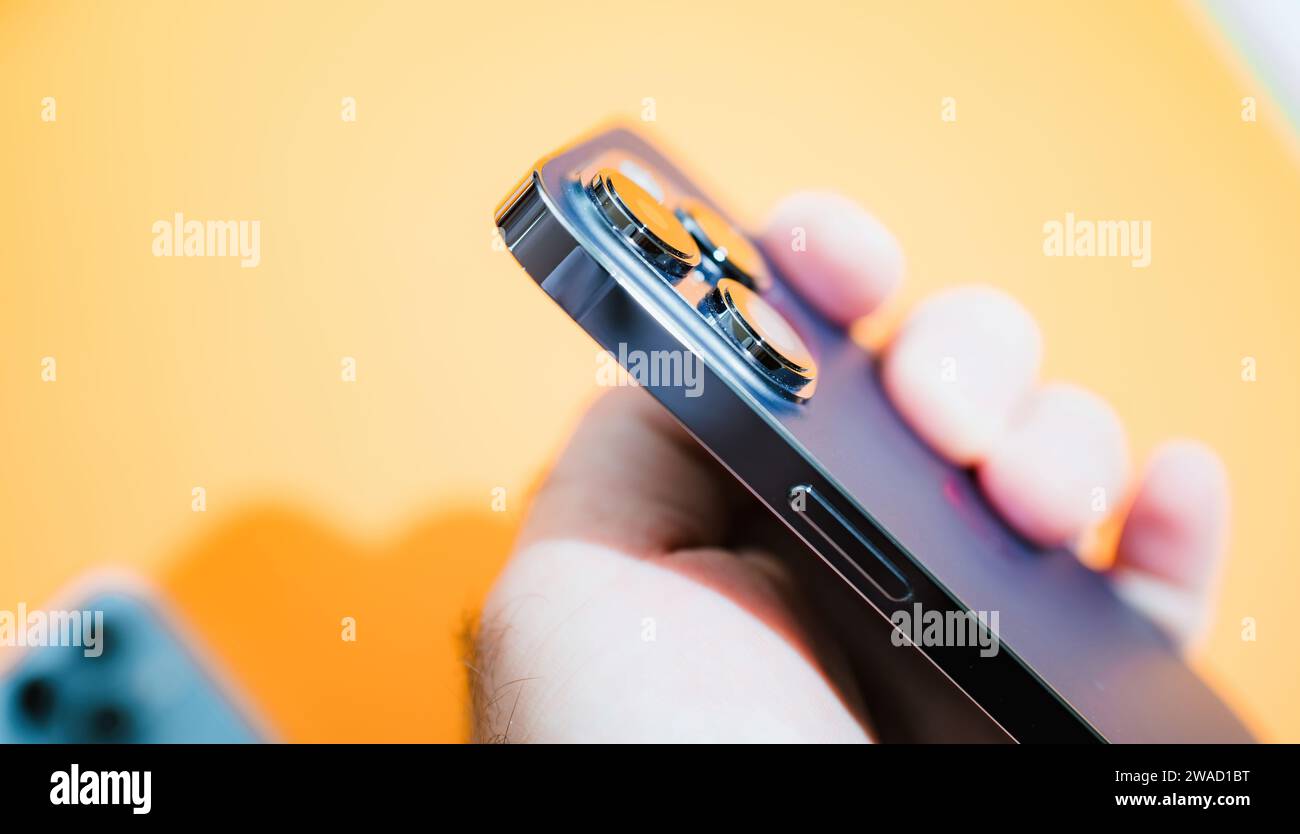 Paris, France - Sep 29, 2022: Male hand presenting the new Apple iPhone ...