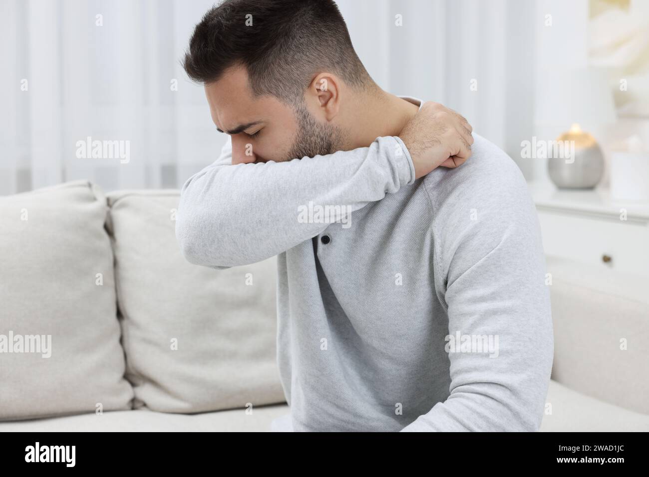 Sick man coughing at home. Cold symptoms Stock Photo - Alamy