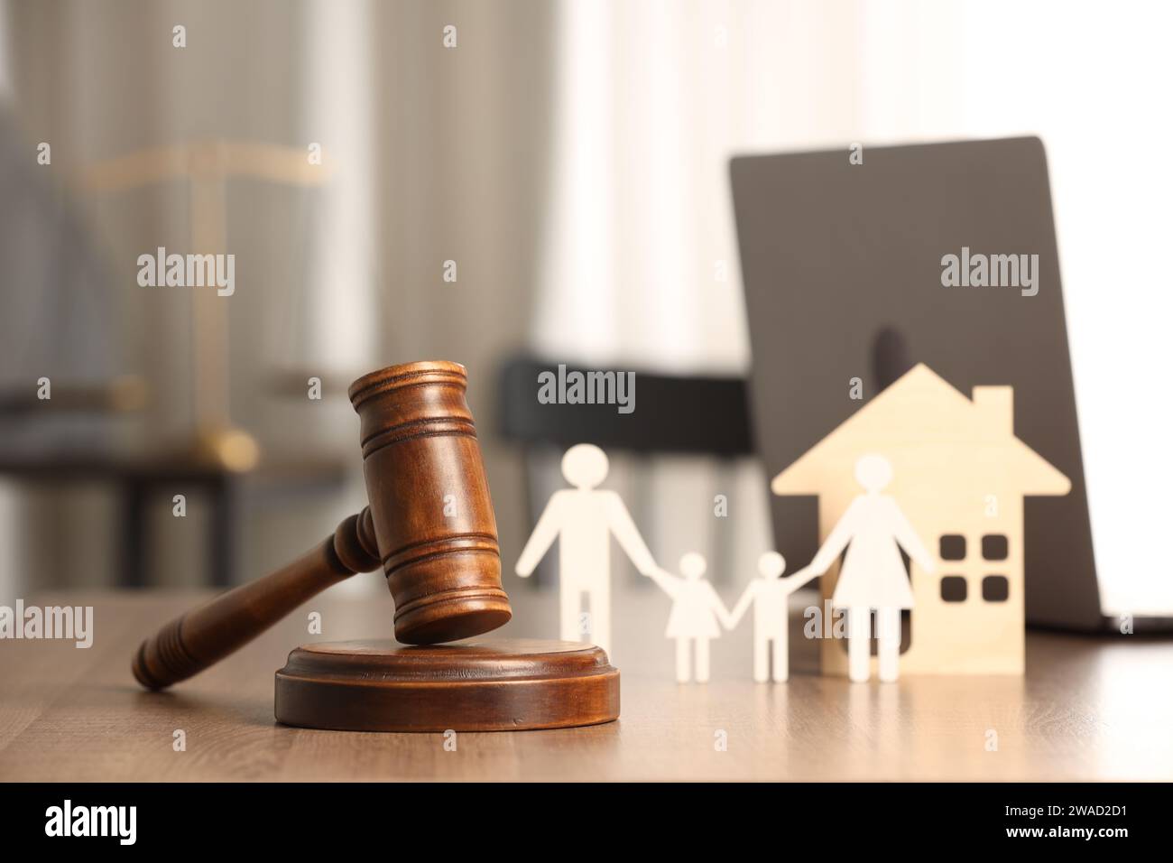 Law concept. Gavel, figures of parents with children and house on ...