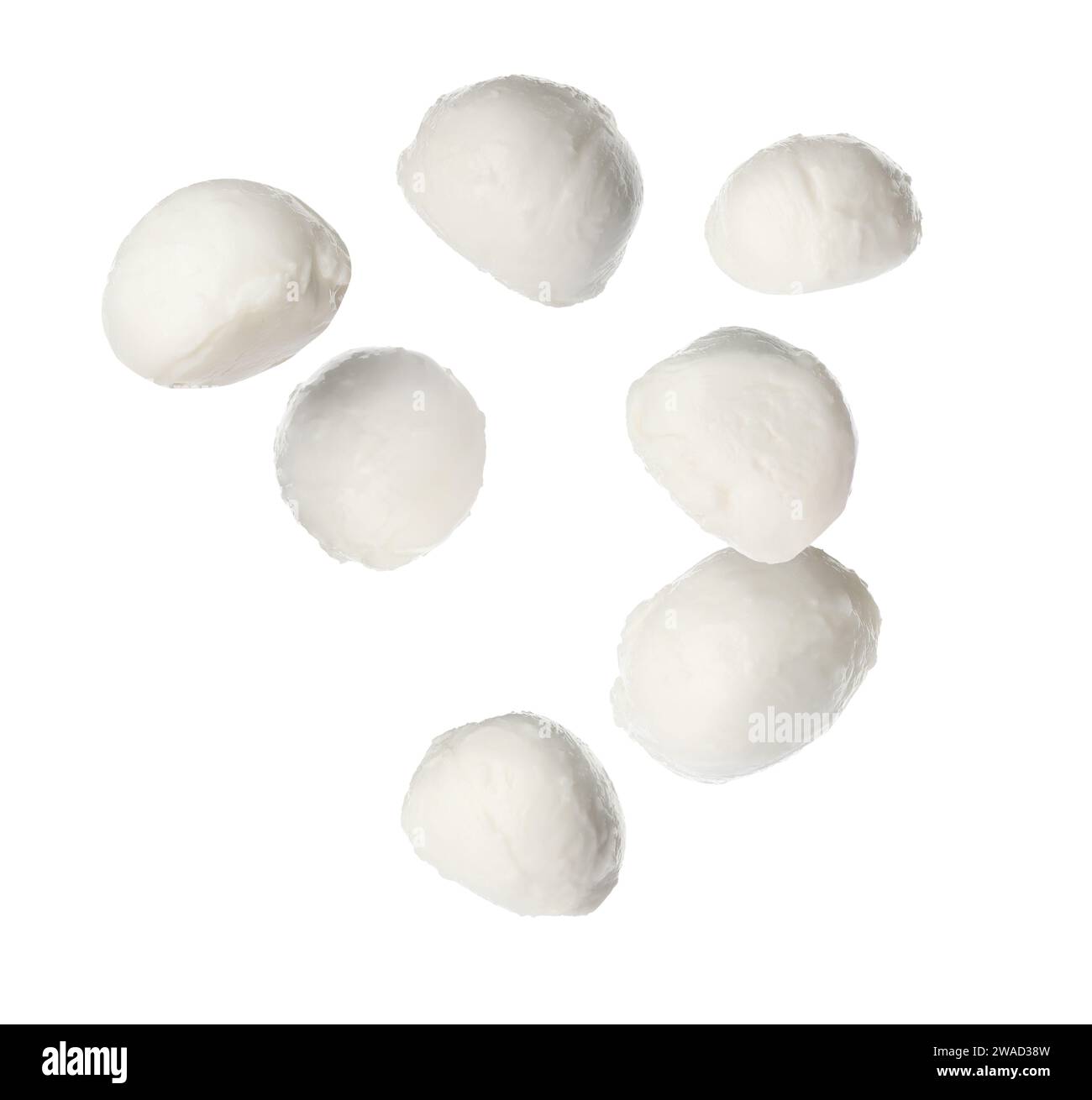 Fresh mozzarella balls falling on white background Stock Photo - Alamy