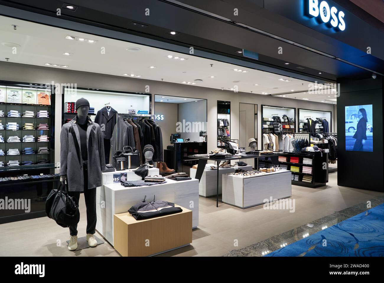SINGAPORE - NOVEMBER 07, 2023: clothes on display inside Boss store ...