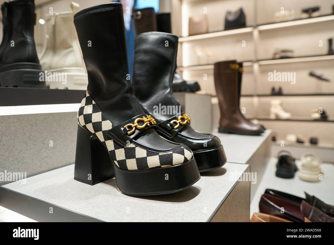 SINGAPORE - NOVEMBER 05, 2023: footwear displayed inside Charles and ...